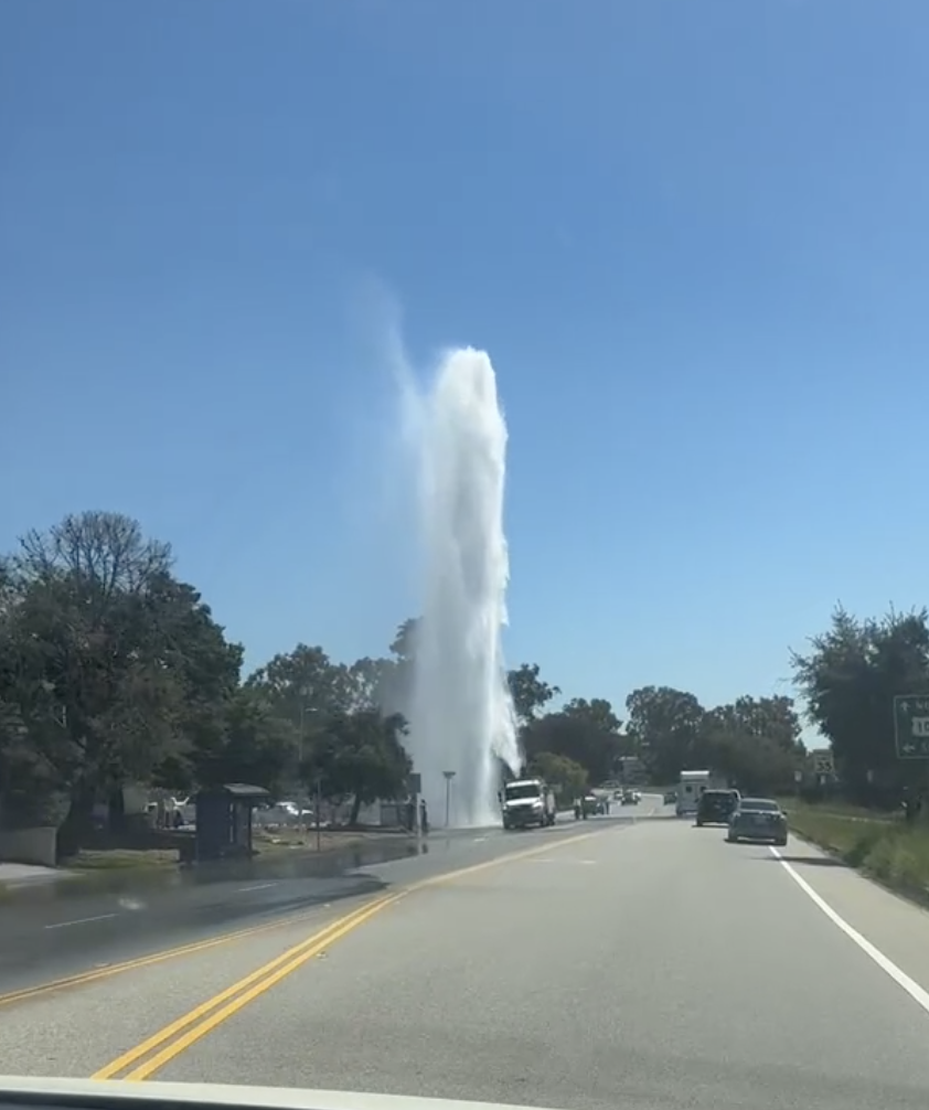 Water geyser erupts from fire hydrant after semi-truck collision ...